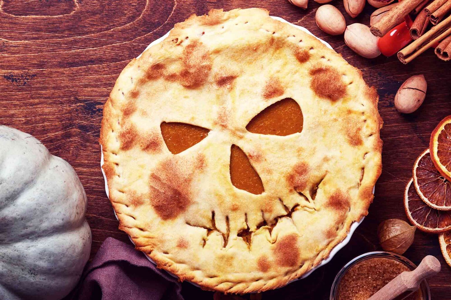 Homemade Pumpkin Pie With A Scary Face For Halloween - How To Make Recipes